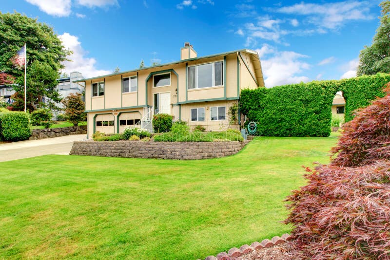 Large American Home with Grass Front Yard, and Garden Area. Stock Image ...
