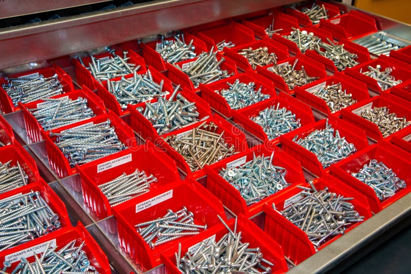 Large Amount of Red Trays with Assorted Screws Stock Photo - Image of ...