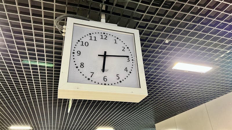 Large Analog Clock Hanging from the Ceiling at a Station Stock Image ...