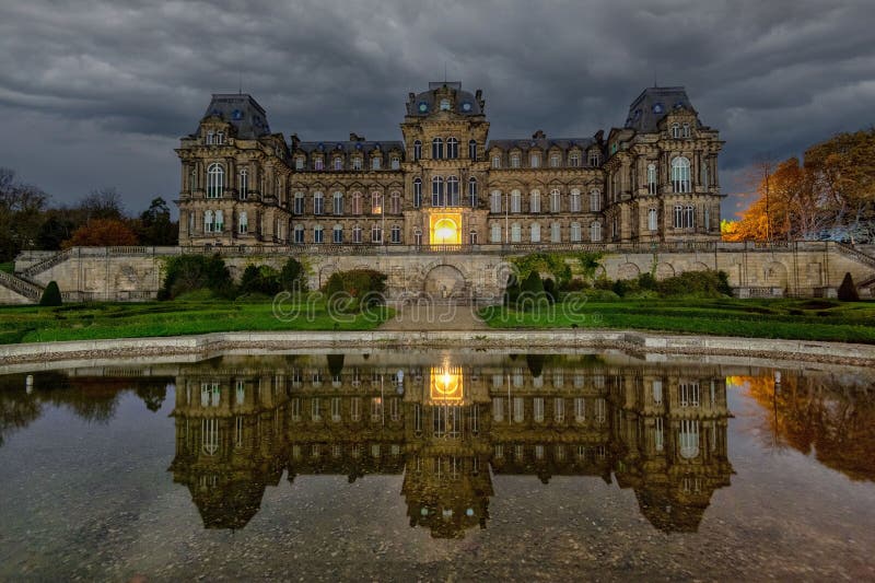 Large Architectural Structure with Numerous Windows and a Sizeable Pool ...