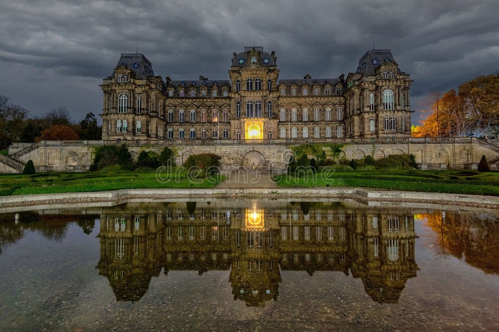 Large Architectural Structure with Numerous Windows and a Sizeable Pool ...