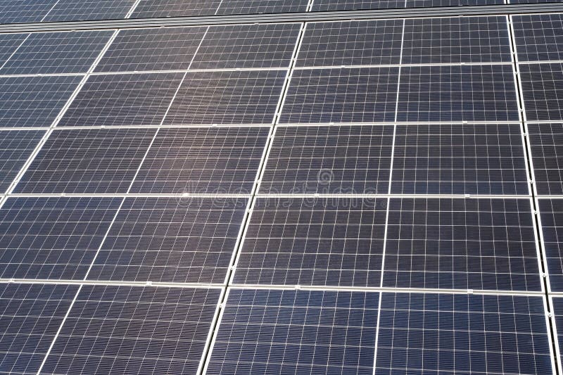 Large Array of Solar Panels Reflecting Sunlight. Stock Photo - Image of ...