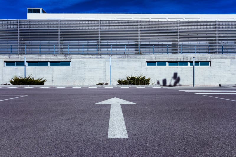 A Large Arrow on the Asphalt Indicates the Direction of a Building ...