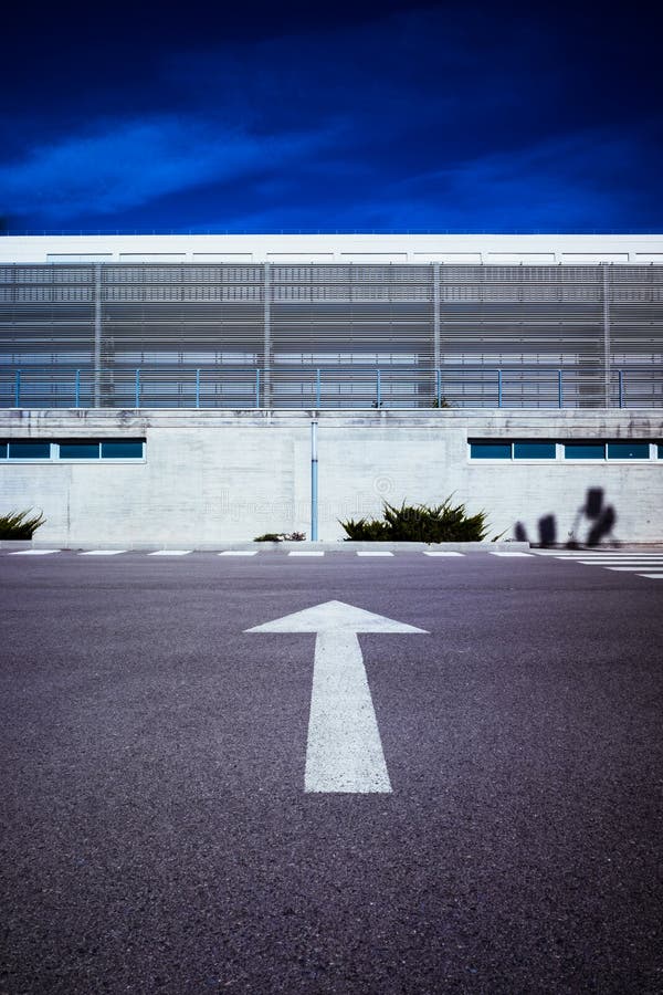 A Large Arrow on the Asphalt Indicates the Direction of a Building ...