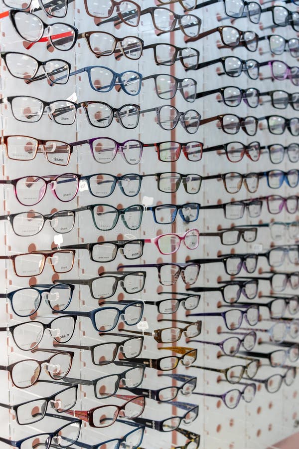 A Large Assortment of Different Glasses on a Shelf in an Optics Store ...