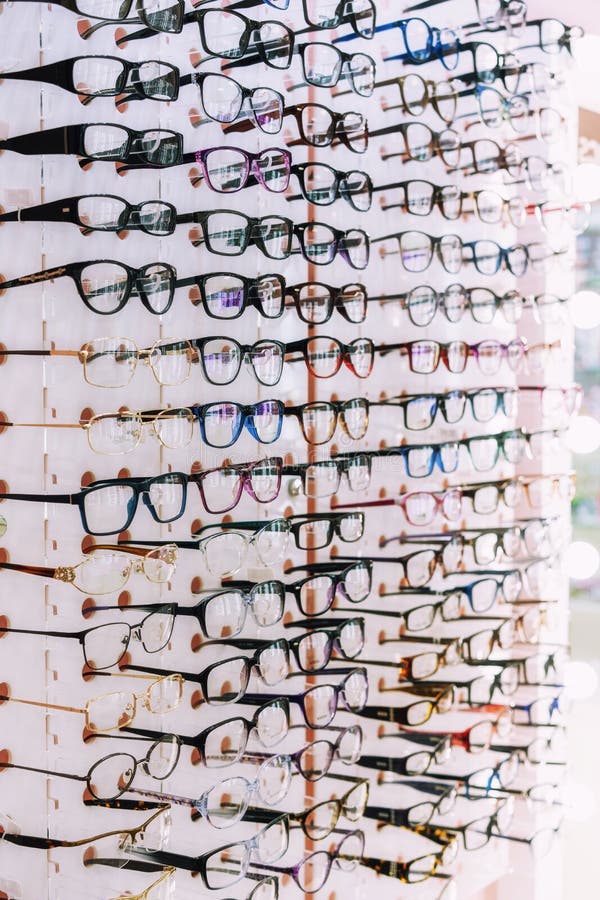 A Large Assortment of Different Glasses on a Shelf in an Optics Store ...