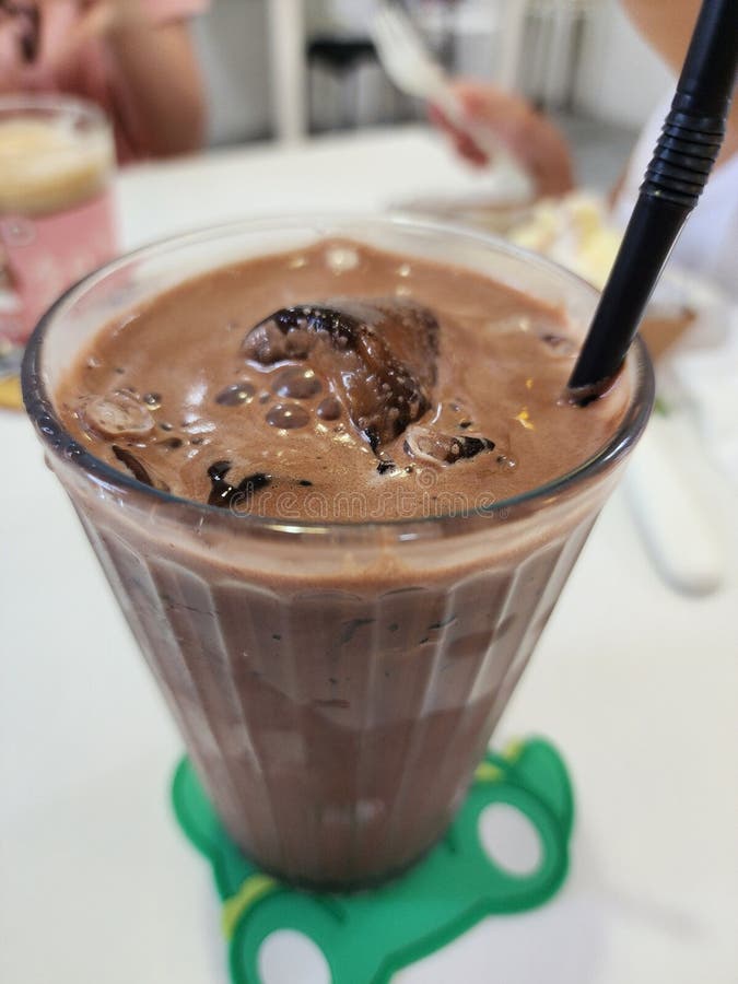 Some Very Big Nice Looking Chocolate Drink Sitting on the Table Stock ...