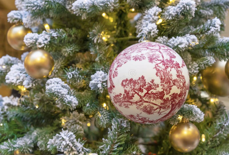 Large Ball with Floral Ornaments on the Christmas Tree Stock Photo ...