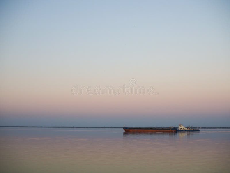 Large Barge Floats on a Smooth River at Sunset Stock Photo - Image of ...