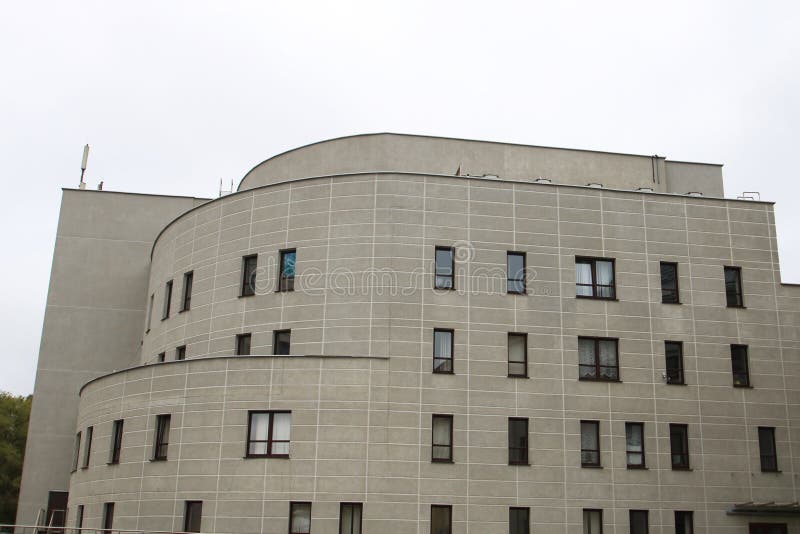 A Large, Beautifully Curved Building Featuring Numerous Windows Stock ...
