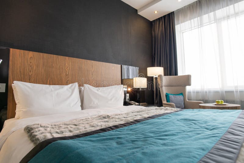 Large Bed Inside Bedroom in Modern Hotel Stock Image - Image of duvet ...