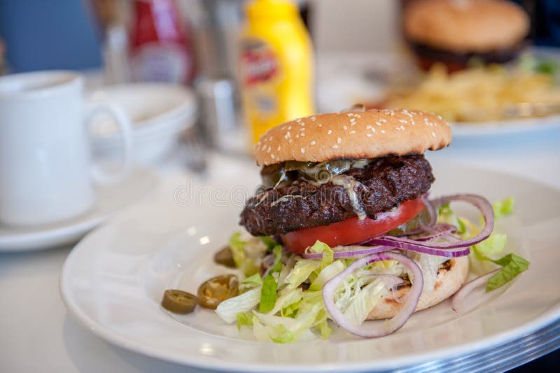 Large beef burger meal stock photo. Image of cheeseburger - 64325870
