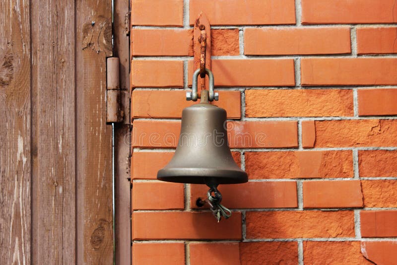A Large Bell Next To the Door, Replacing the Doorbell. the Bell Welcome ...