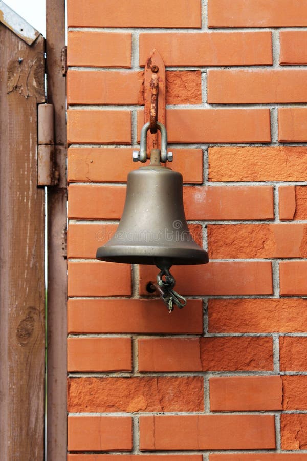 A Large Bell Next To the Door, Replacing the Doorbell. the Bell Welcome ...