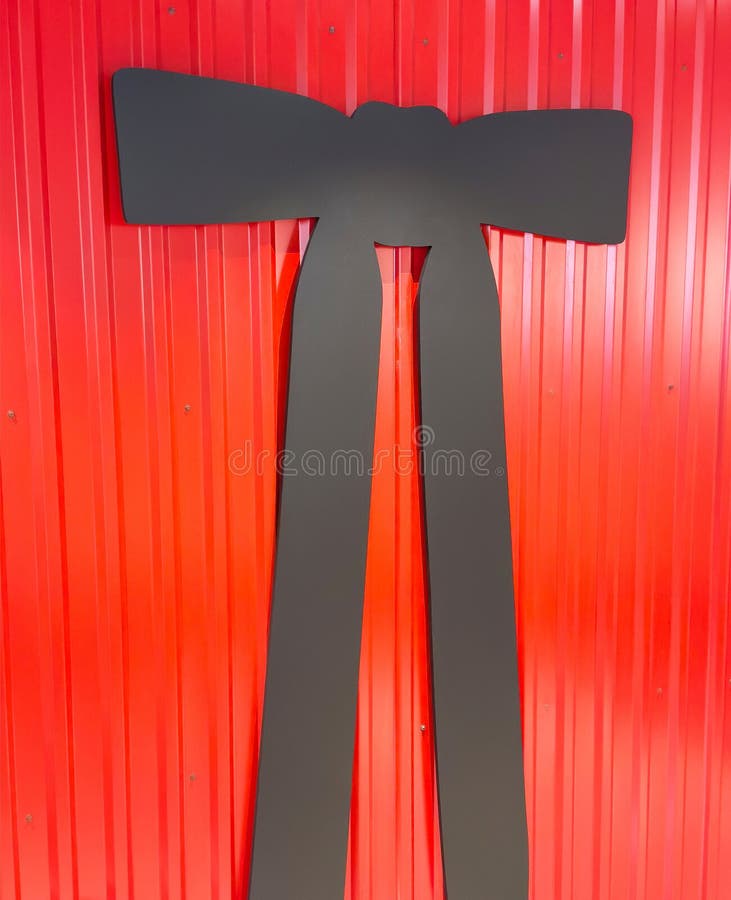 Large Black Bow on Red Vertical Panel Background Stock Image - Image of ...