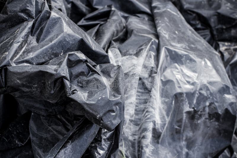 Large Black and Rumpled Plastic Garbage Bag Stock Photo - Image of ...