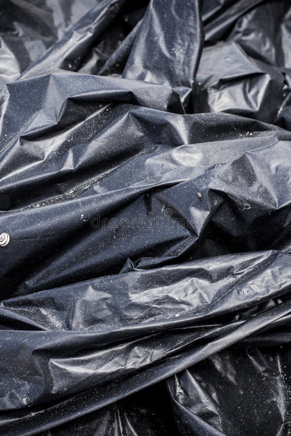 Large Black and Rumpled Plastic Garbage Bag Stock Photo - Image of ...