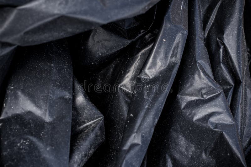Large Black and Rumpled Plastic Garbage Bag Stock Photo - Image of ...