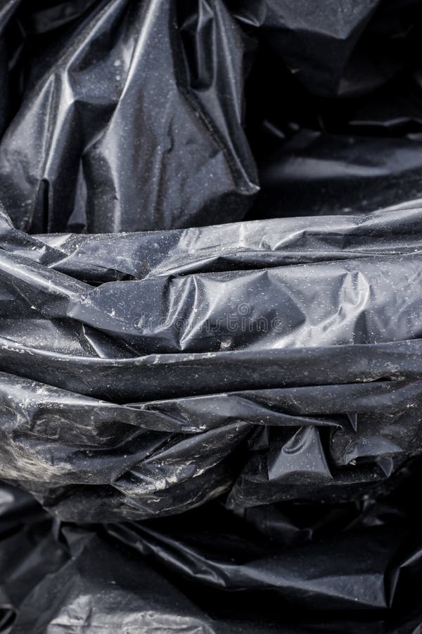 Large Black and Rumpled Plastic Garbage Bag Stock Image - Image of ...
