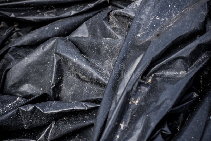 Large Black and Rumpled Plastic Garbage Bag Stock Image - Image of ...