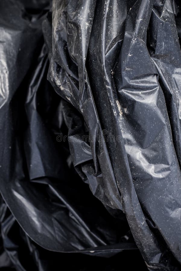 Large Black and Rumpled Plastic Garbage Bag Stock Photo - Image of ...