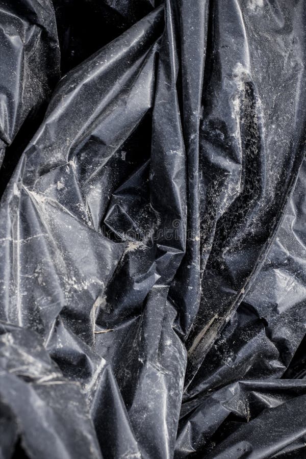 Large Black and Rumpled Plastic Garbage Bag Stock Photo - Image of ...