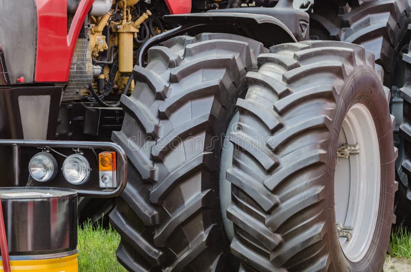 A Large Black Tractor Wheel with a Tread Stock Photo - Image of tractor ...