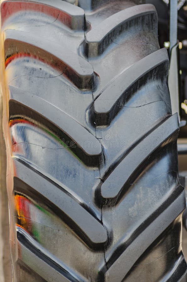 A Large Black Tractor Wheel with a Tread Stock Image - Image of ...