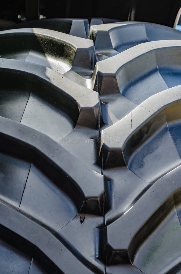 A Large Black Tractor Wheel with a Tread Stock Photo - Image of tractor ...