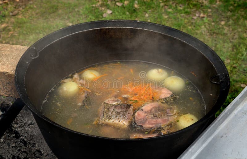 Large Black Vat with Fish Soup Stock Photo - Image of outdoors, fish ...