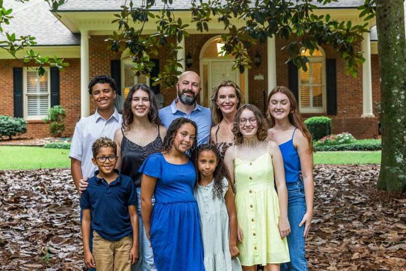 A Large and Blended and Mixed Happy Family Standing in Front of Their ...