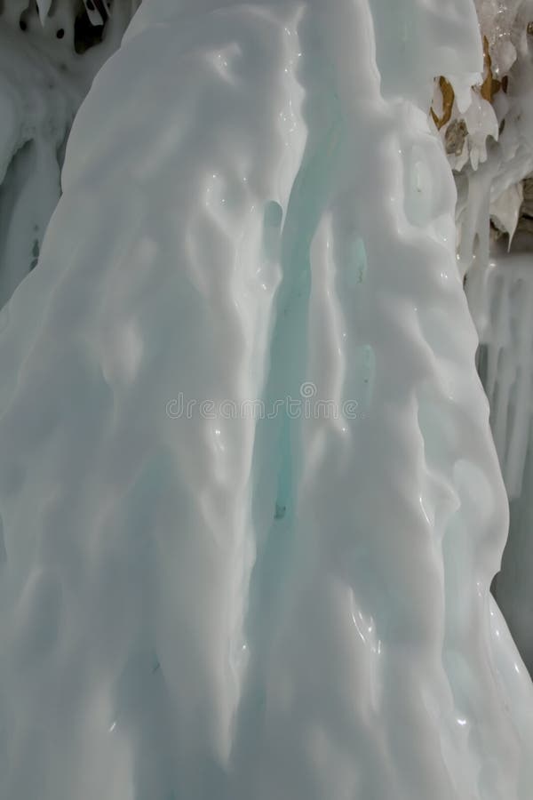 A Large Block of Ice is Hanging on a Rock Stock Image - Image of ...