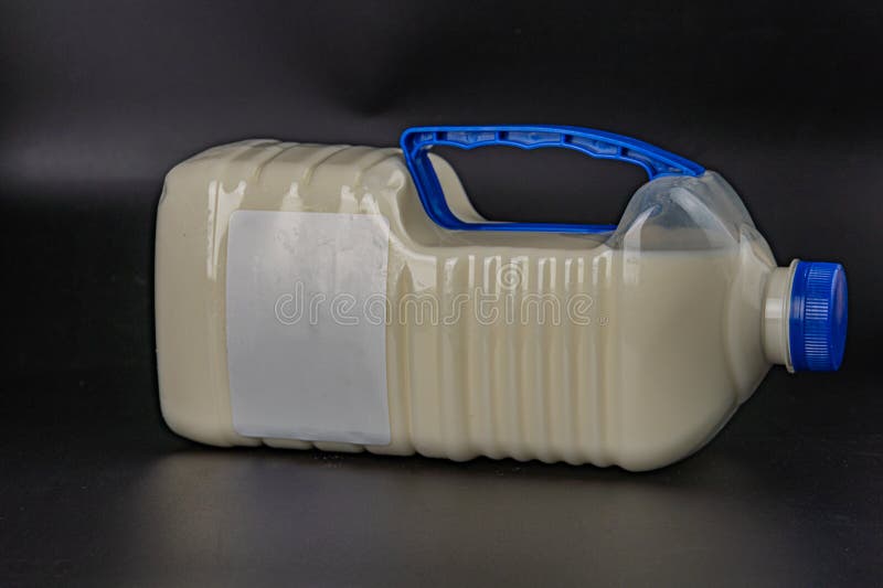 Large, Blue-capped Milk Jug Displayed on a Plain Background, Possibly ...