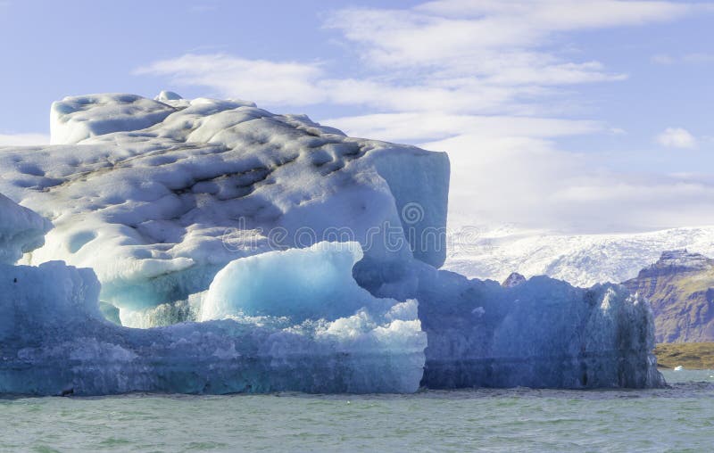 A Large Blue Ice Block is Floating in the Ocean Stock Image - Image of ...