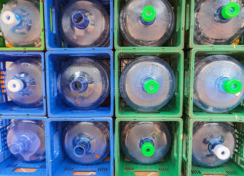 Large Blue Plastic Water Bottles in Container Stock Photo - Image of ...
