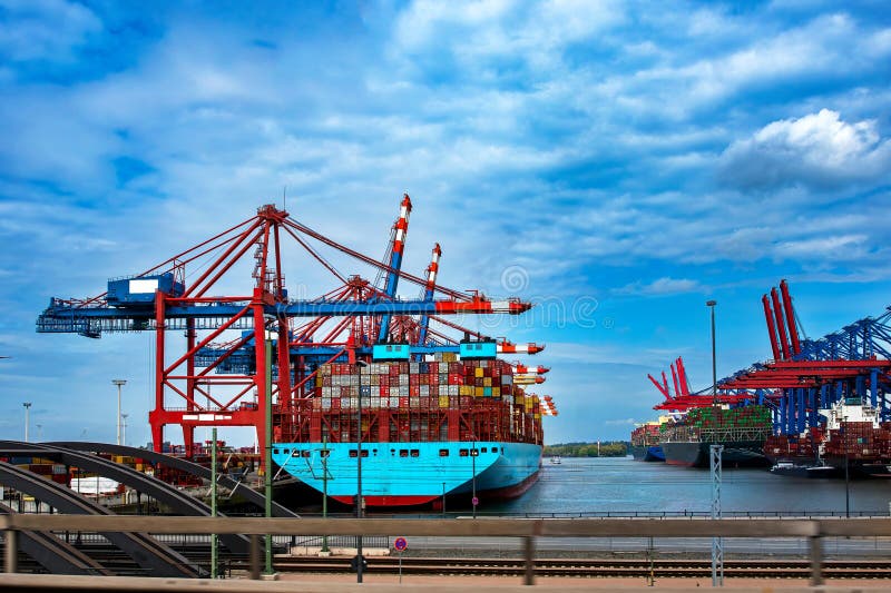 A Large Boat Rests in the Dock Under the Blue Sky and Clouds Stock ...