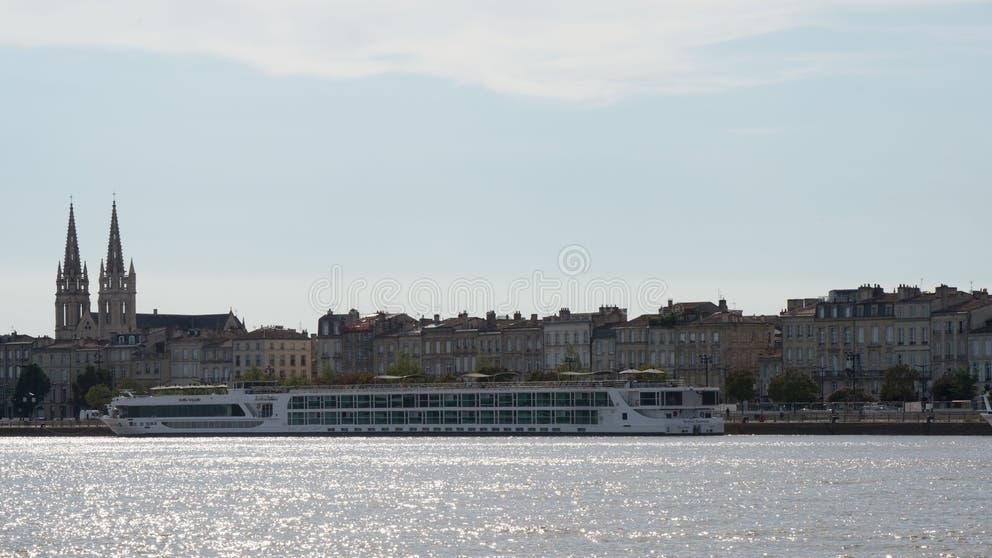 Large Boat on the River with Gothic Architecture in the Background on a ...