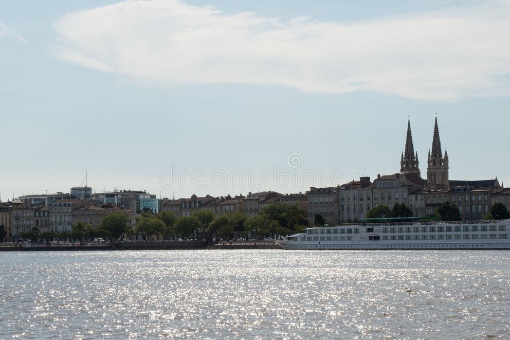 Large Boat on the River with Gothic Architecture in the Background on a ...