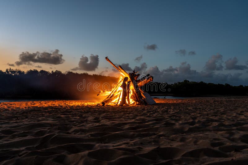 A Large Bonfire on the Beach at Sunset Stock Photo - Image of fire ...