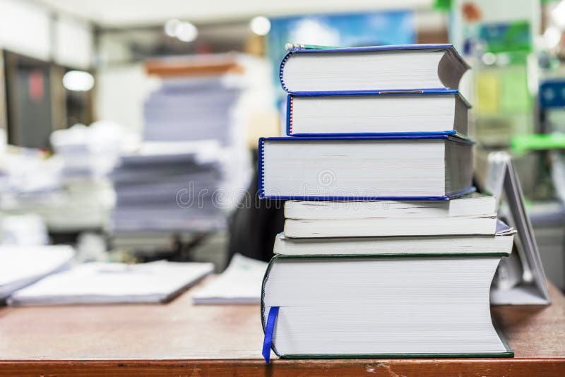 Large Books Stacked on a Table in a Library. Stock Photo - Image of ...