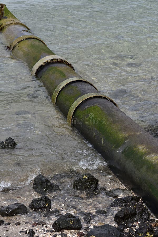 Large Bore Metal Pipe Entering Sea Stock Photo - Image of coast ...