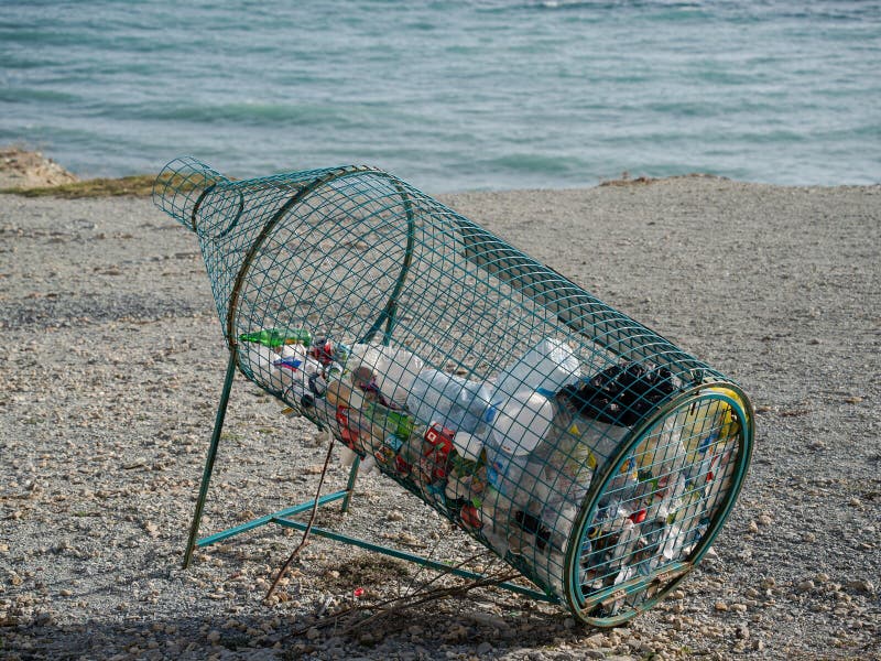 A Large Bottle-shaped Trash Can for Plastic Against the Backdrop of the ...