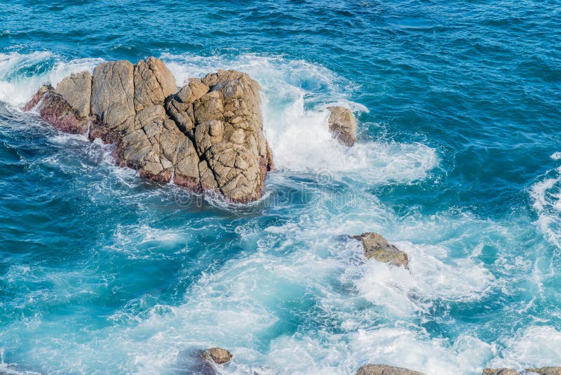 Large Boulders in Blue Ocean Water Stock Image - Image of seascape ...