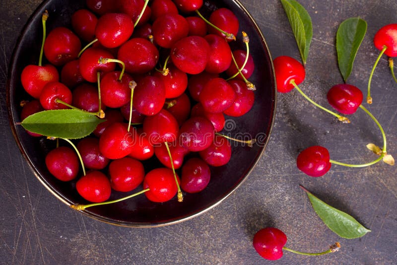 Large Bowl of Bright Red Cherries on Dark Background Stock Image ...