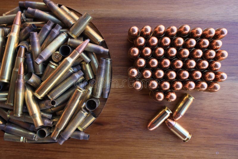 A large bowl of bullets stock photo. Image of cartridges - 186896152