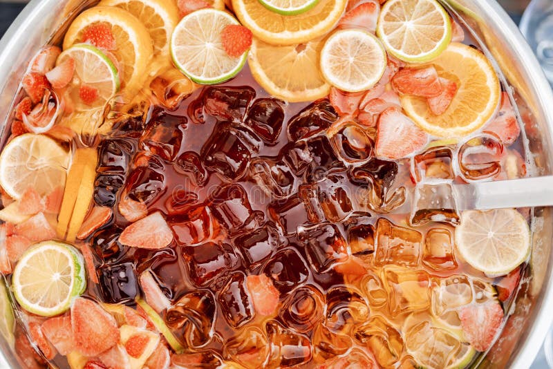 Large Bowl of Lemonade with Ice and Sliced Fruit Stock Photo - Image of ...