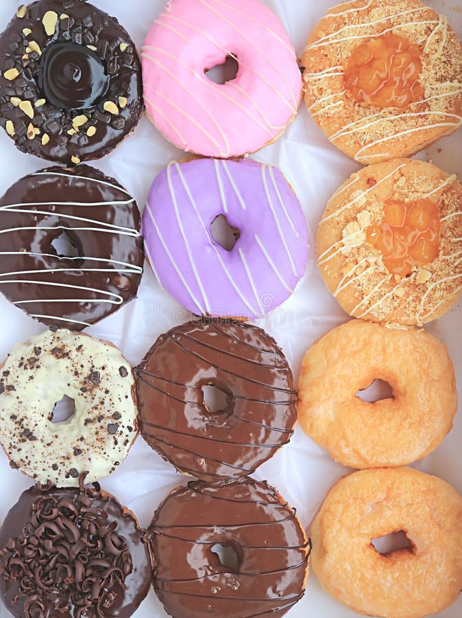 A Large Box of Colorful Assorted Delectable Doughnuts Stock Image ...