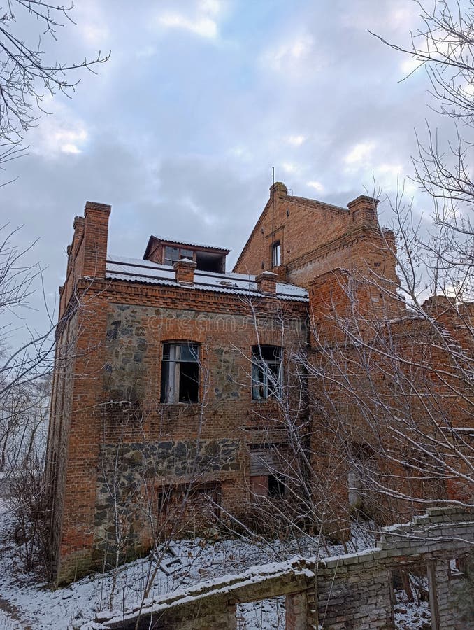 A Large Brick Building with a Lot of Snow on the Ground Stock Image ...
