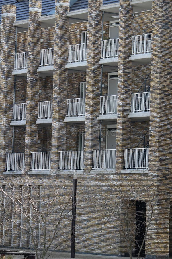 Large Brick Building with Multiple Balconies Stock Photo - Image of ...