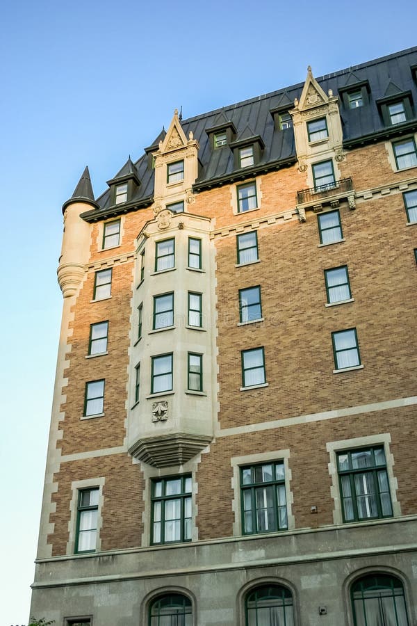 A Large Brick Building with a Steeple on Top Stock Image - Image of ...